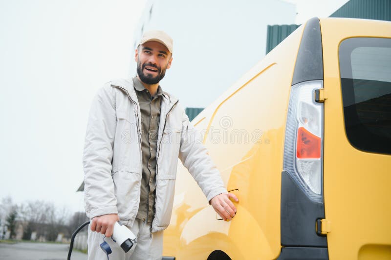 Man Holding Power Connector for Electric Car Stock Image - Image of ...
