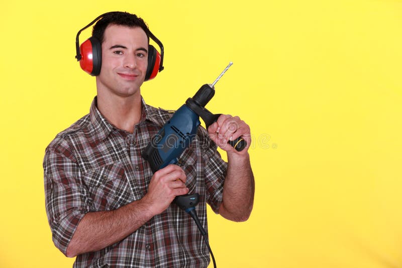 Man with drill machine stock photo. Image of construction - 26128204