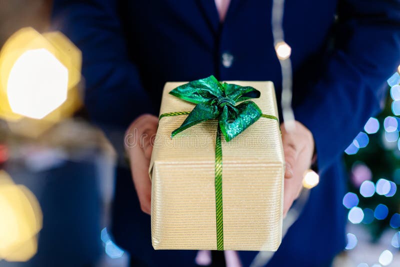 Man Holding Present in Hand Stock Image - Image of hold, christmas ...