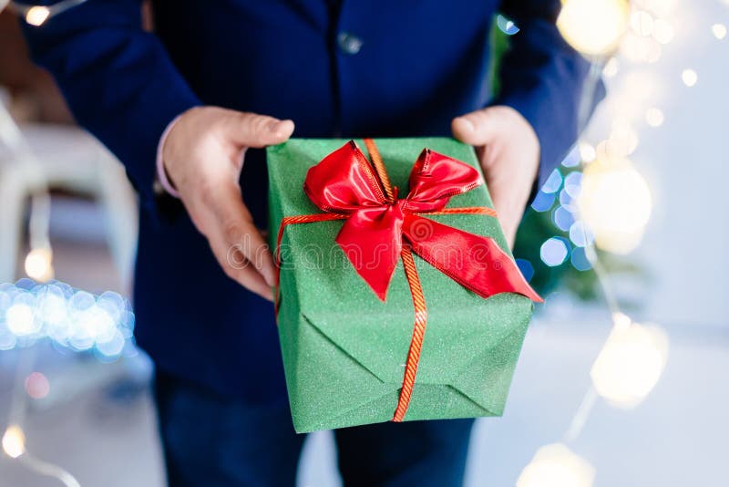 Man Holding Present in Hand Stock Photo - Image of valentines, holiday ...