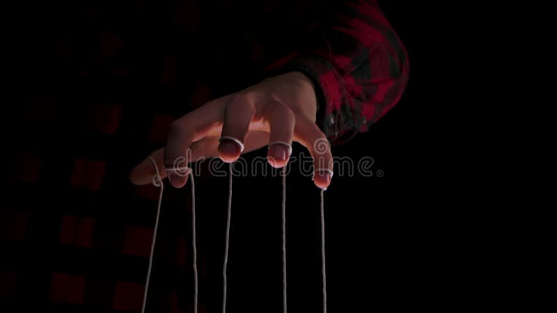 Man Holding a Puppet String. Close Up Human Hand Controls a Puppet with ...