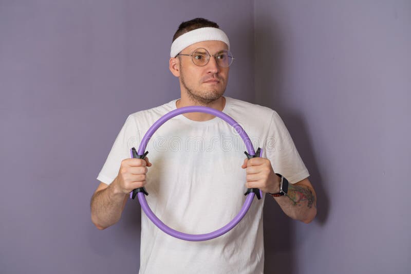Man Holding Purple Exercise Ring Front Wall Stock Photos - Free ...