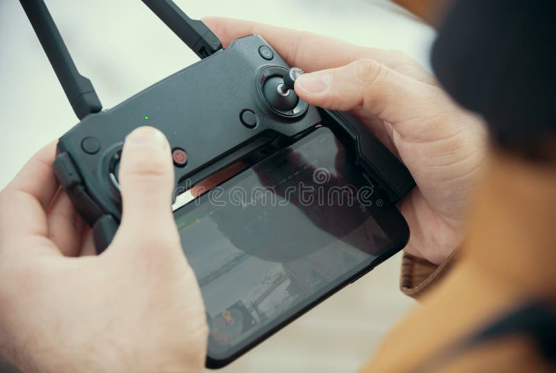 A Man Holding an Remote Control for the Drone - Tracking the Drone ...
