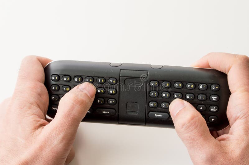 Man Holding a Remote Control Keypad Stock Photo - Image of holding ...