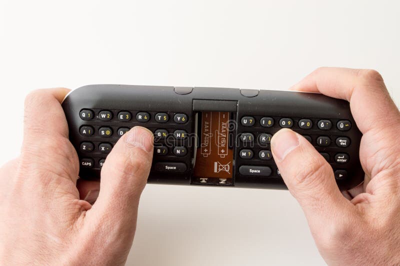 Man Holding a Remote Control Keypad Stock Photo - Image of black ...