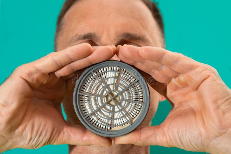 Man Holding Respirator Filter before Face Stock Image - Image of filter ...