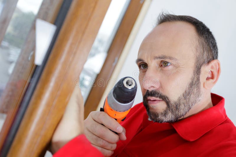 Man holding rotary drill stock image. Image of handyman - 196188359