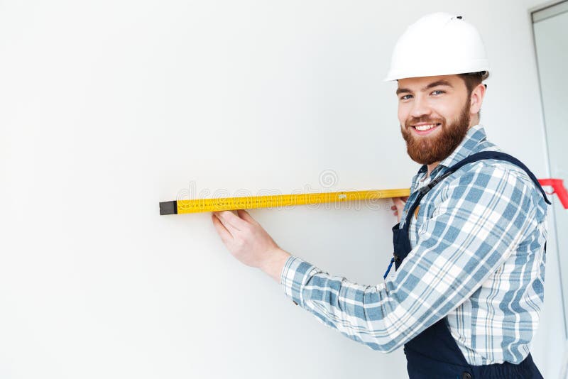 Man Holding Ruler and Looking Camera Stock Photo - Image of equipment ...