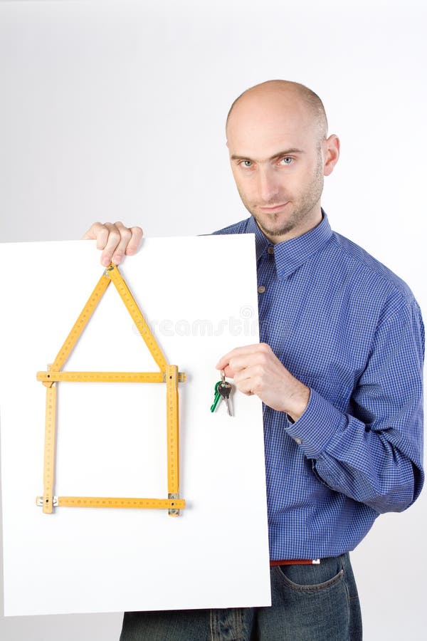 Man Holding Rulers And Keys Stock Photo - Image of building, caucasian ...