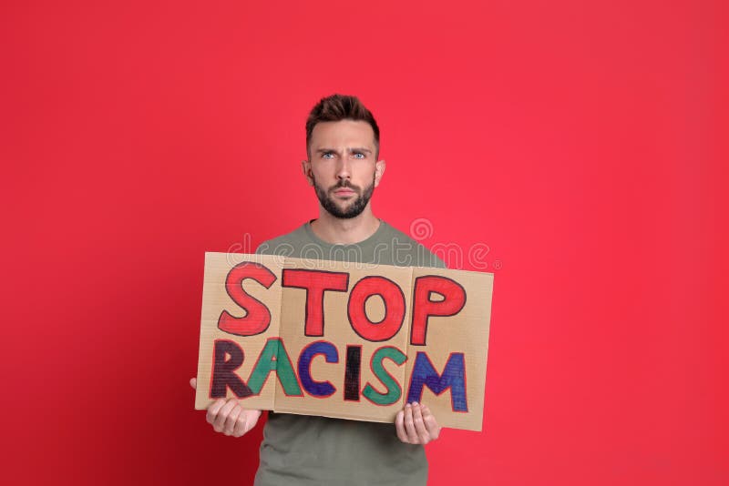 Man Holding Sign with Phrase Stop Racism on Red Background Stock Image ...