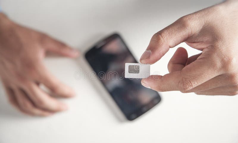 Man Holding Sim Card with Smartphone Stock Photo - Image of network ...