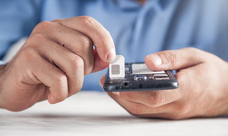 Man Holding Sim Card with Smartphone Stock Image - Image of electronic ...