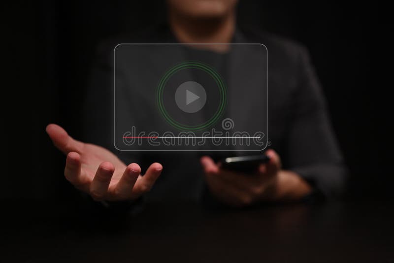 Man Holding Smart Phone with Play Button on Virtual Screen. Stock Image ...