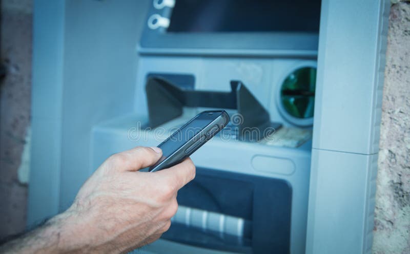 Man Holding Smartphone. ATM. Online Transaction Stock Photo - Image of ...