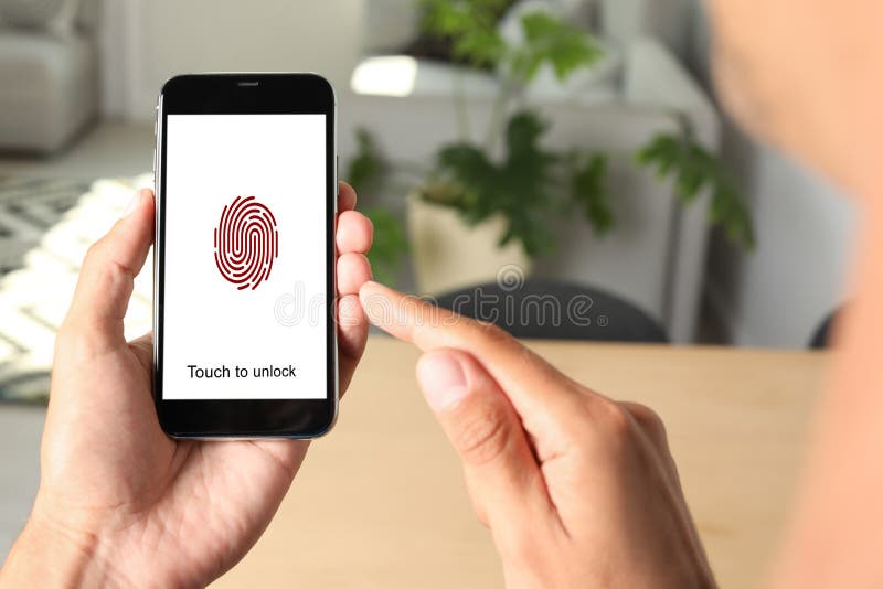 Man Holding Smartphone with Fingerprint Sensor Indoors. Digital ...