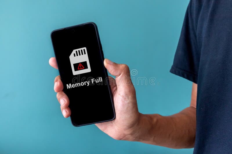 Man Holding a Smartphone with Memory Space Full Notification on Screen ...