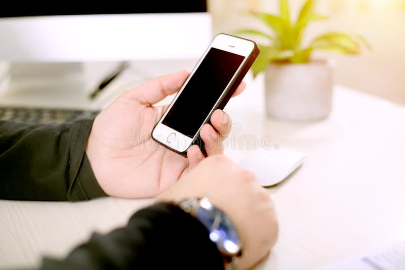 Man holding phone in hand. stock image. Image of computer - 120523495