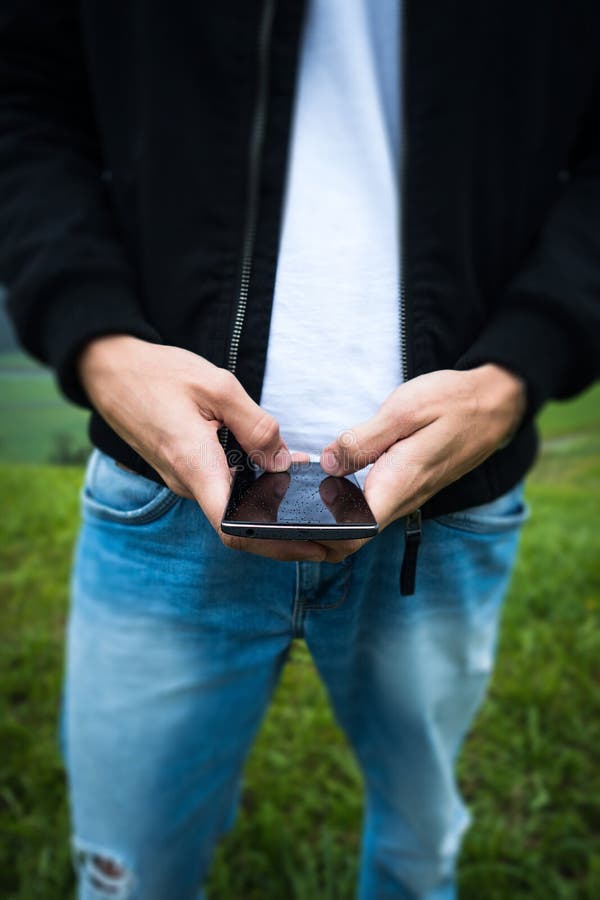 Man holding smartphone stock image. Image of telecommunicatio - 99780629