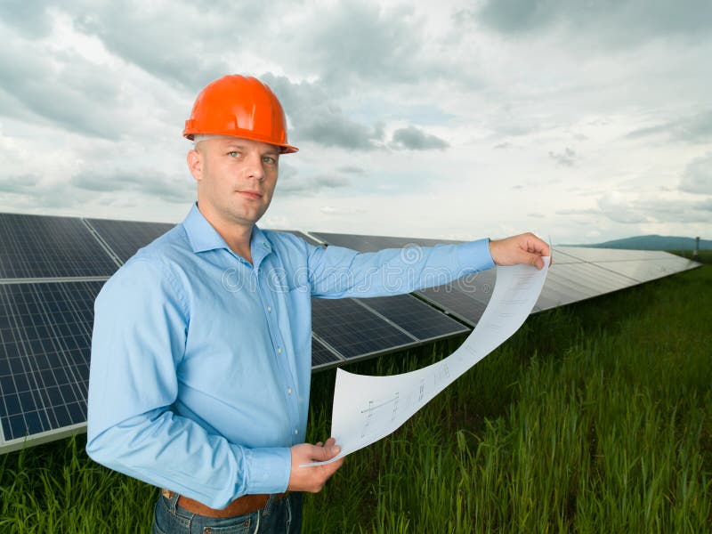 Man Holding Solar Panel Station Plans Stock Image - Image of ...