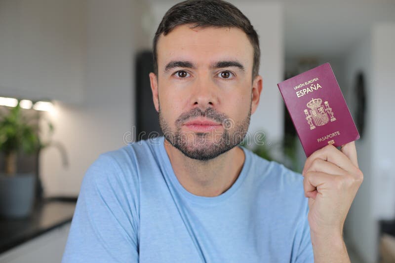 Man Holding a Spanish Passport Stock Photo - Image of emigration, token ...