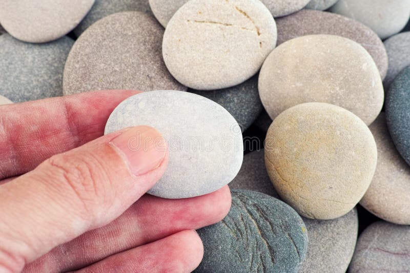 Man Holding a Stone in His Hand Stock Image - Image of ground, shore ...