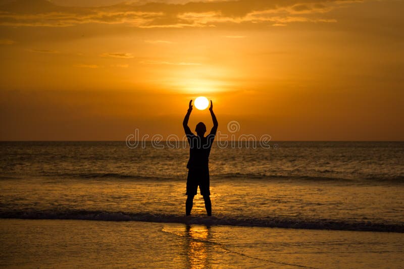 Man Holding the Sun stock image. Image of lifestyle, gold - 29678775