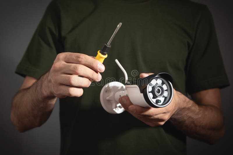 Man Holding Surveillance Security Camera and Screwdriver Stock Image ...