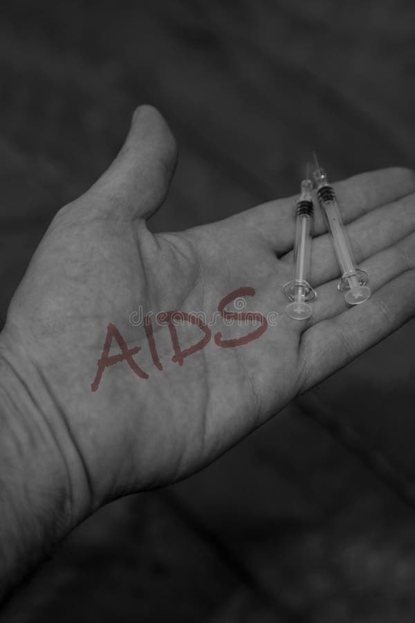 Man Holding Syringes Needles with the Word Aids Written on His Hands ...