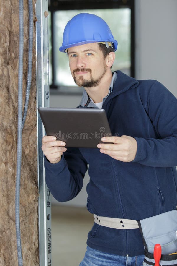 Man Holding Tablet in Construction Site Stock Photo - Image of 2529 ...