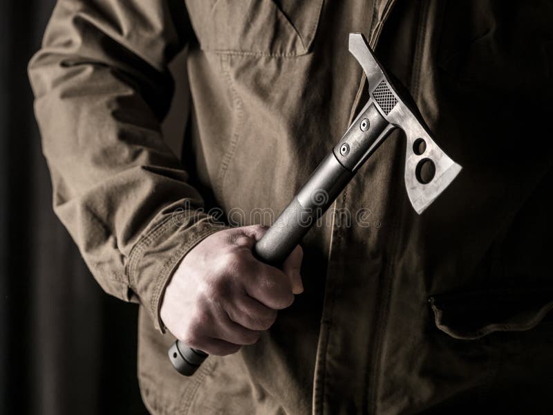Man Holding a Tactical Tomahawk Stock Image - Image of black, threat ...