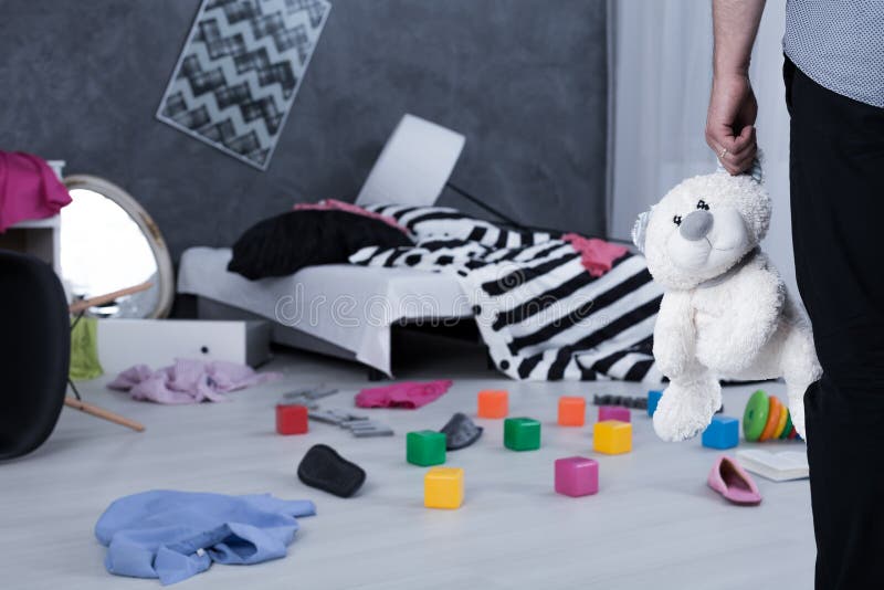 Man holding teddy bear stock photo. Image of building - 82186884