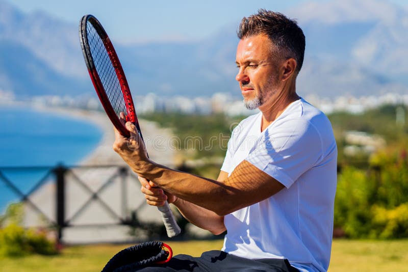 Man Holding Tennis Racket Outdoors at Sunny Day Stock Image - Image of ...