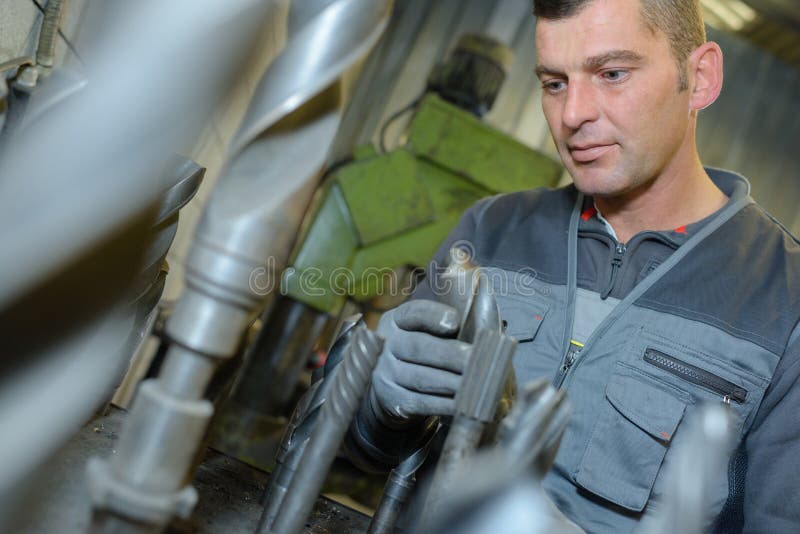 Man Holding Threaded Metal Bar Stock Image - Image of tighten, tool ...