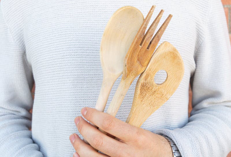 Man Holding Kitchen Utensils Stock Image - Image of holding, utensils ...
