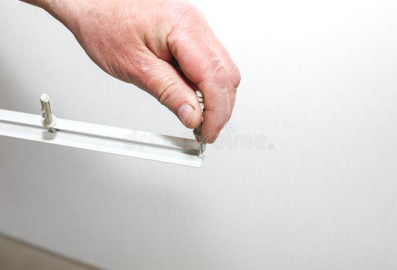 Man Holding Threshold Panel Indoors. Renovation Works in the Flat Stock ...