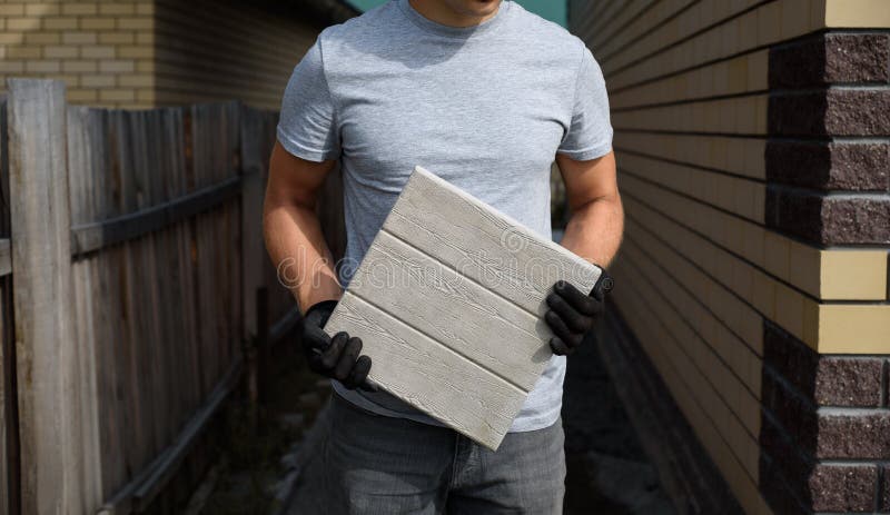 Man Holding Paver Block Stock Photos - Free & Royalty-Free Stock Photos ...