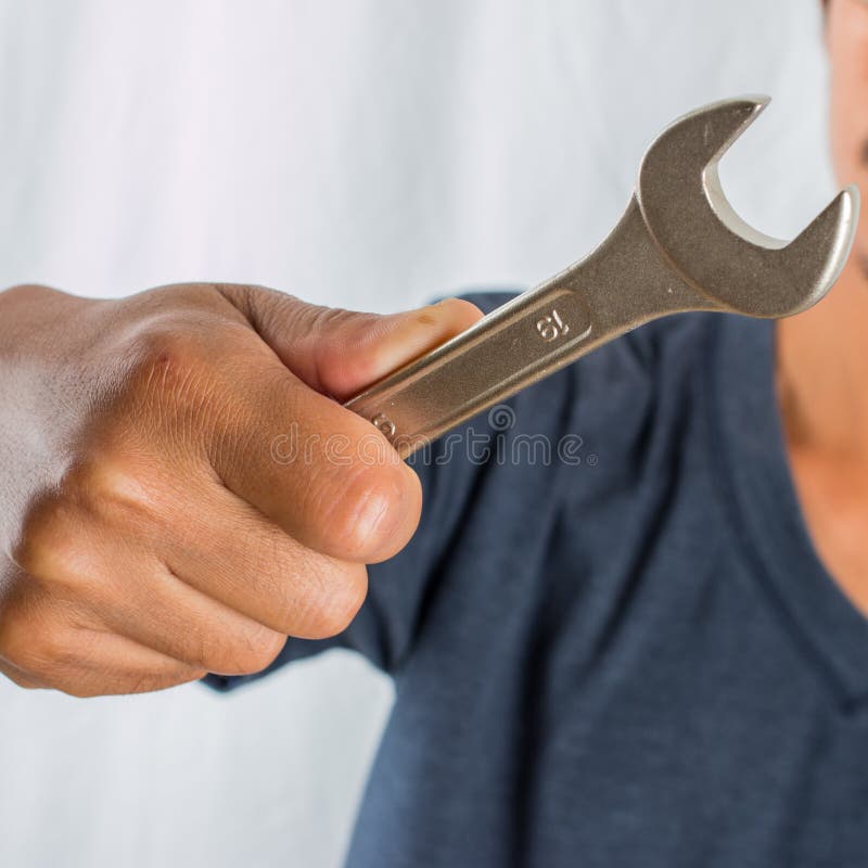 Man holding tool stock photo. Image of spanner, manual - 36304650