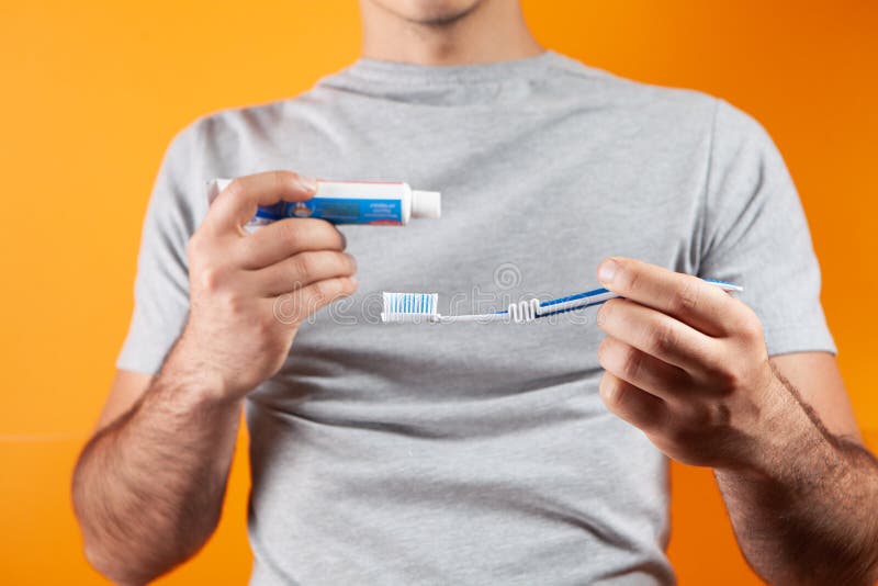 Man Holding Toothbrush and Toothpaste Stock Photo - Image of handsome ...