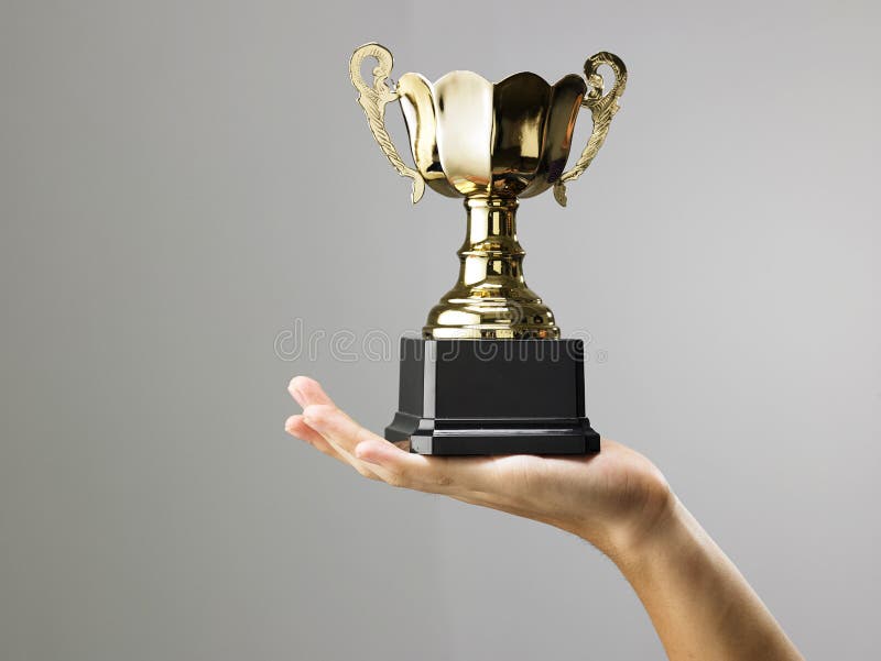 Man holding trophy stock photo. Image of honour, place - 48625280