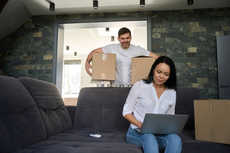 Man Holding Two Boxes Behind Young Woman S Back Stock Image - Image of ...