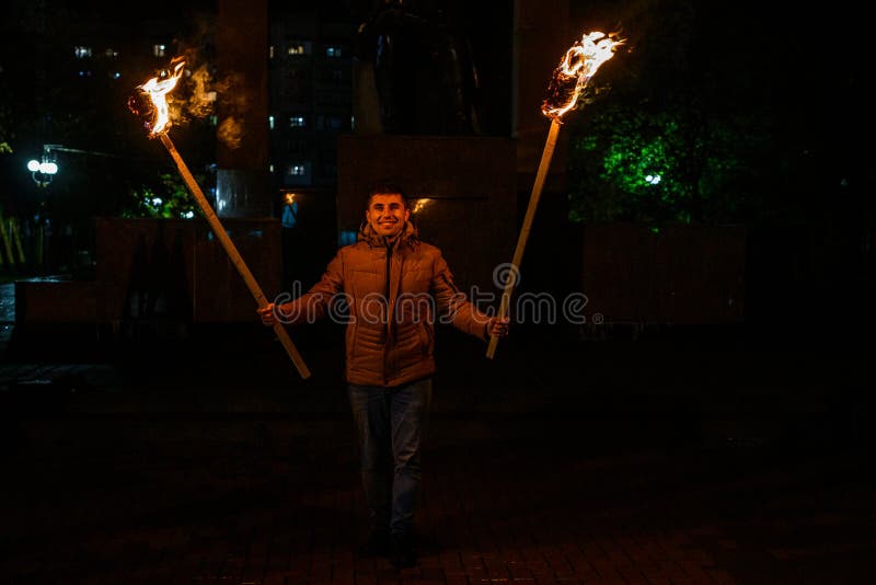 The Man is Holding Two Torches, a Peaceful Participant of the Action ...