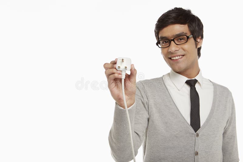 Man Holding Up an Electrical Plug Stock Image - Image of front, camera ...