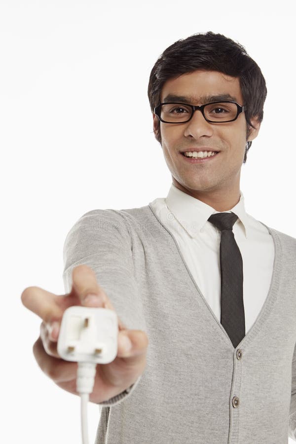 Man Holding Up an Electrical Plug Stock Image - Image of clothing ...
