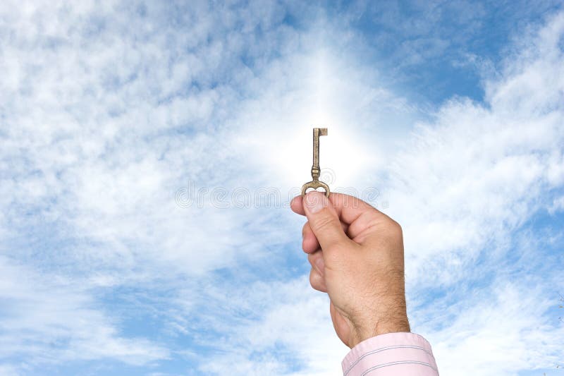 Man Holding Up Key Against Bright Sky Stock Image - Image of clouds ...