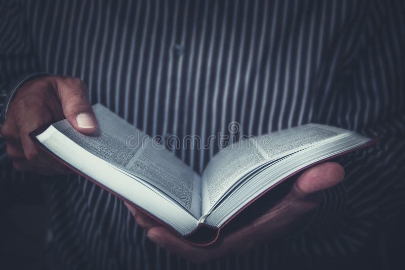 Man Holding Up an Open Bible in His Hands Stock Photo - Image of jesus ...