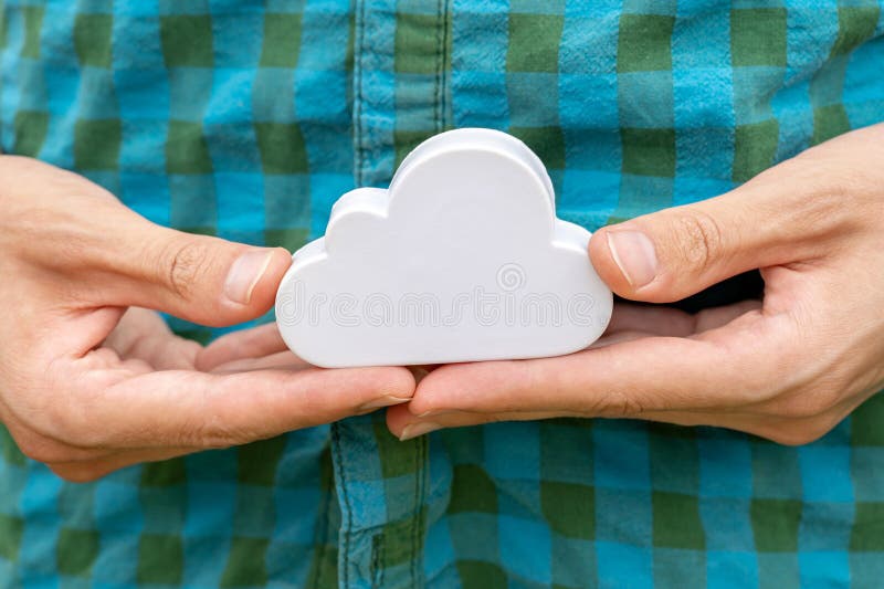 Man Holding Up a Small White Cloud Object Symbol in His Hands, Closeup ...