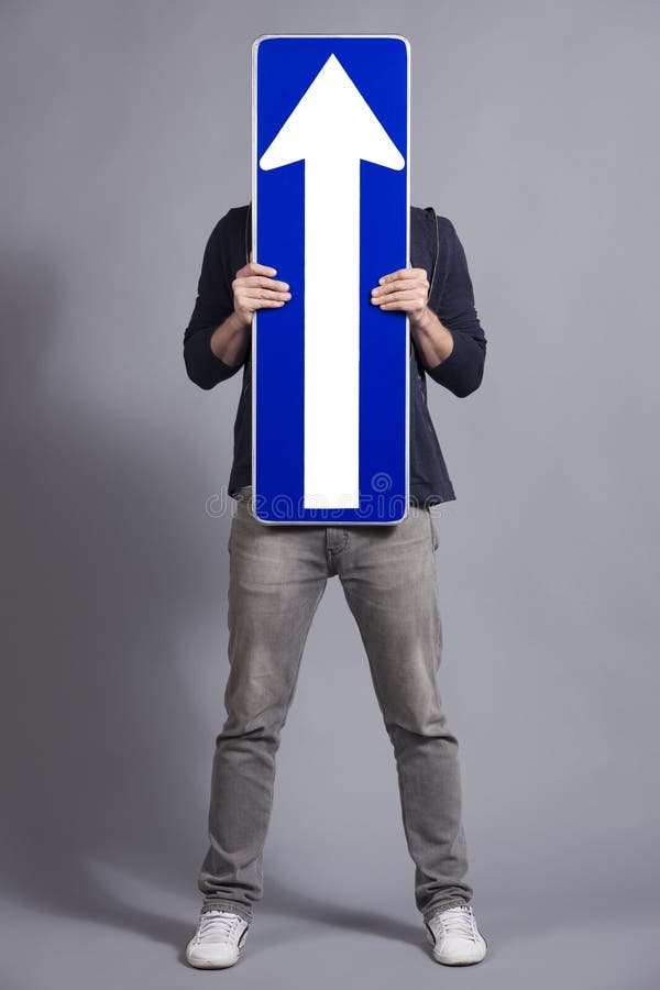 Man Holding Vertical Direction Arrow Sign. Stock Photo - Image of ...