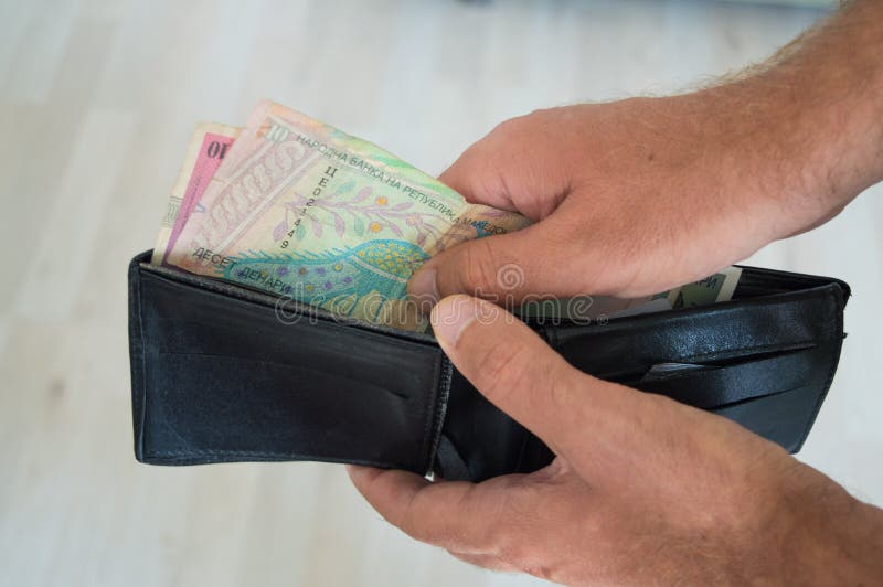 Man Holding a Wallet with Dinars Inside Stock Image - Image of closeup ...