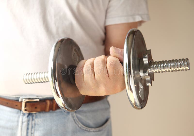 Man holding weight stock photo. Image of strength, hand - 26394606