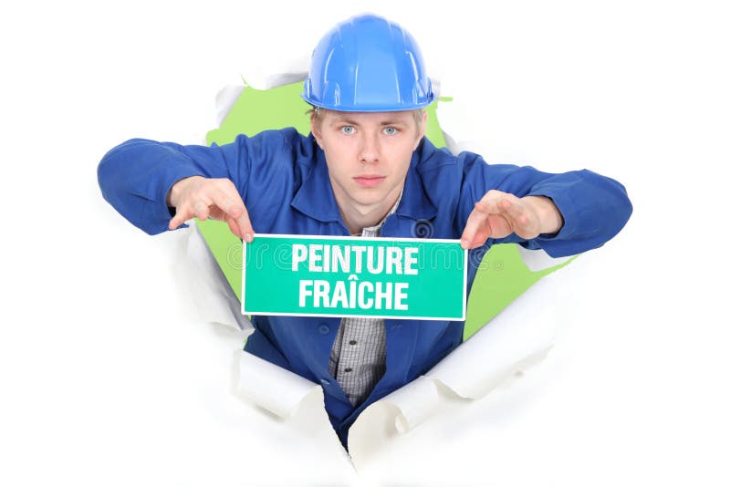 Man holding wet paint sign stock image. Image of plastic - 26794119